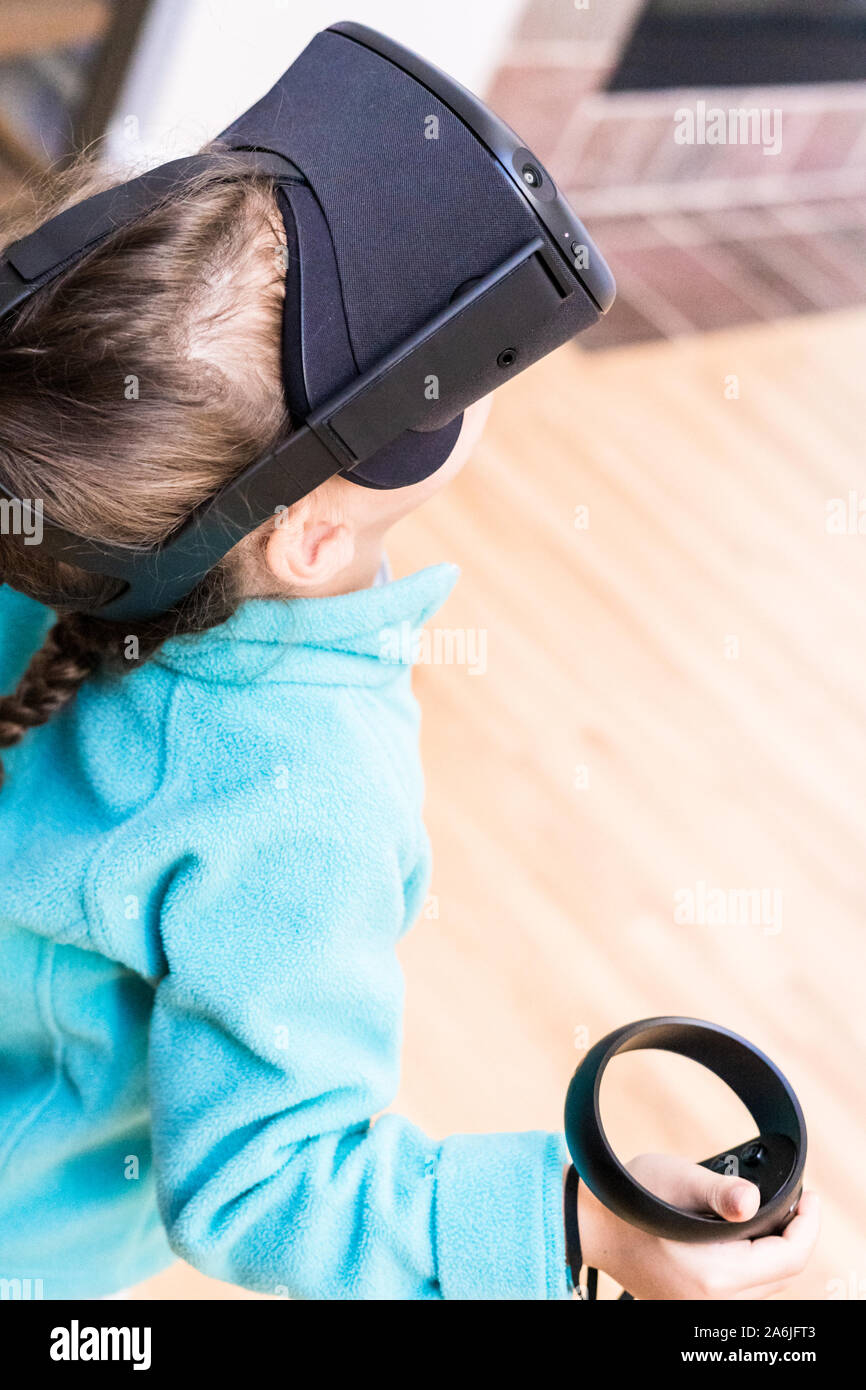 Little girl playing VR kids game in the living room Stock Photo - Alamy