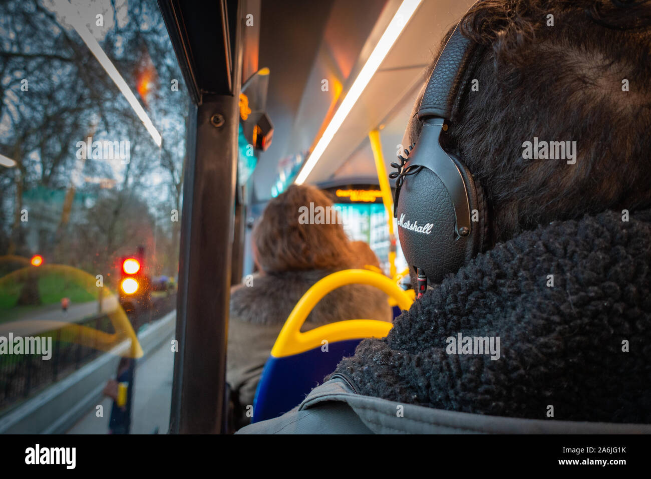 Man wearing headphones on a bus hi-res stock photography and images - Alamy