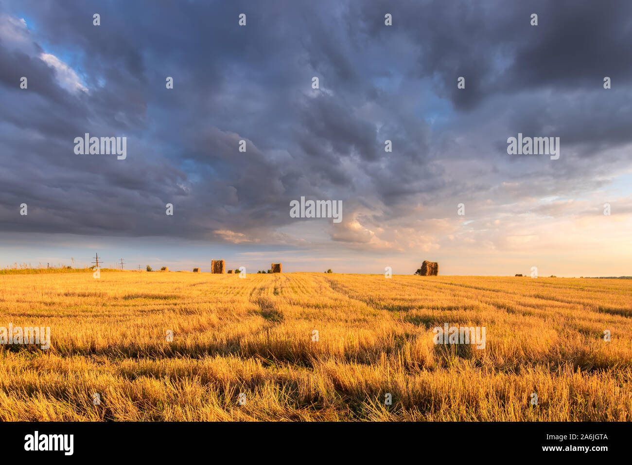 Haystacks on the field in Autumn season. Rural landscape with cloudy ...