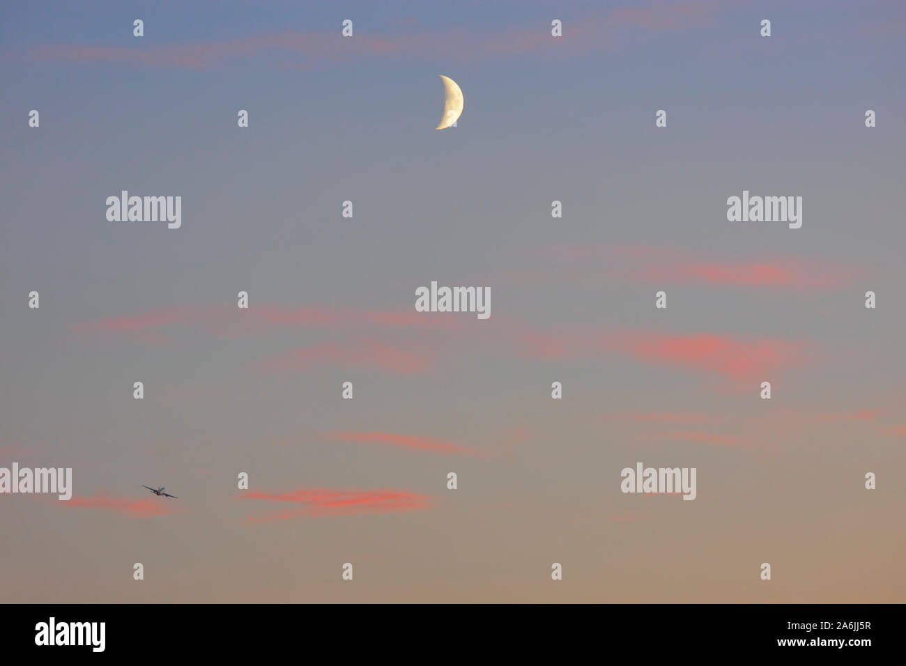 Airplane and moon Stock Photo - Alamy