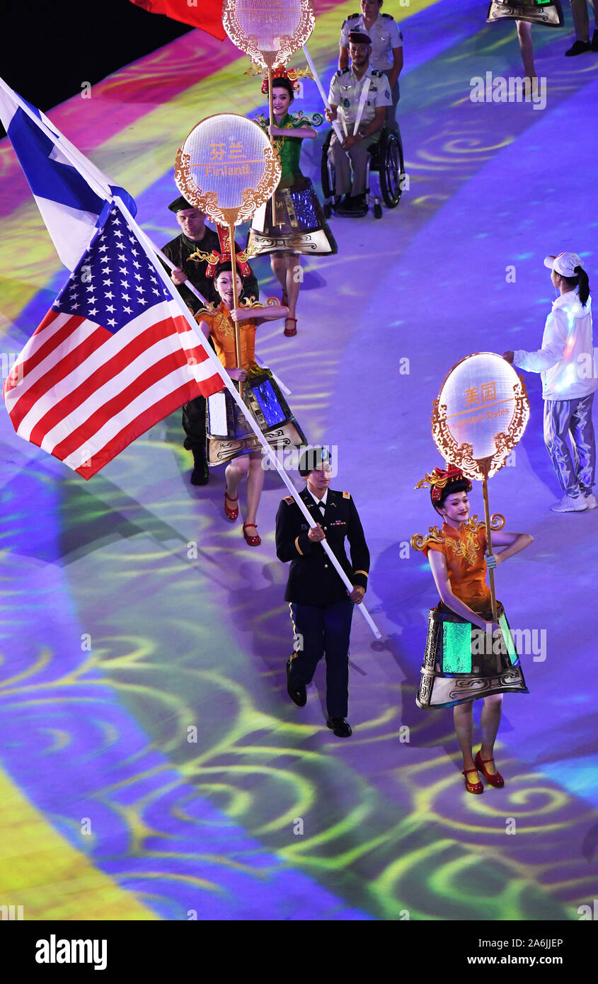 Wuhan, China. 27th Oct, 2019. Flag bearers walk into the stadium during ...