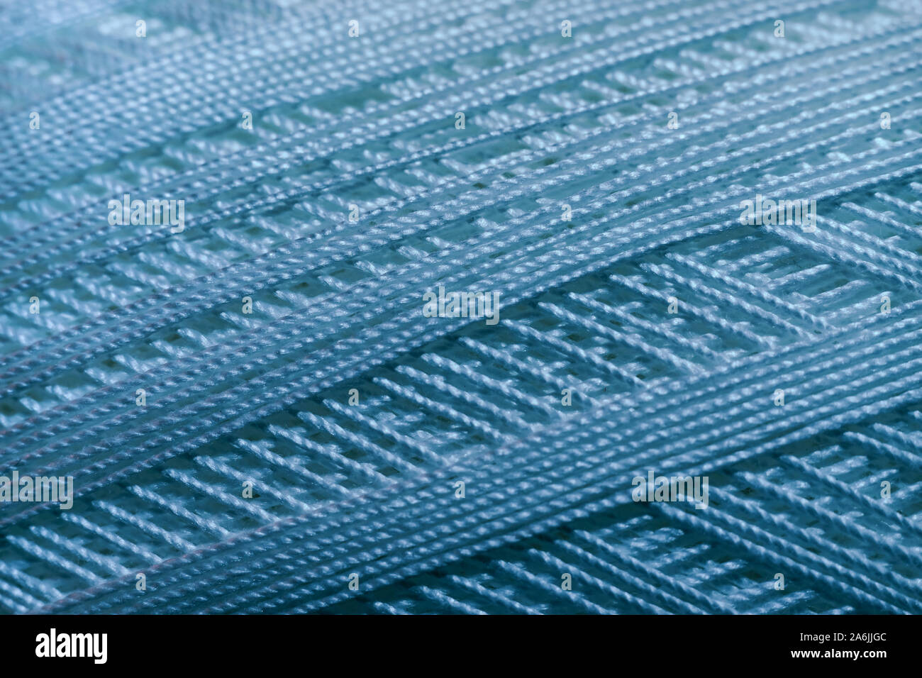 Close up beautiful white thread in red and blue light background ...