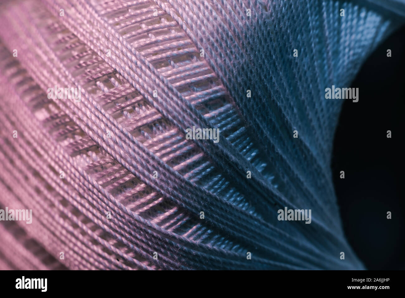 Close up beautiful tangle of thread in red and blue light background ...
