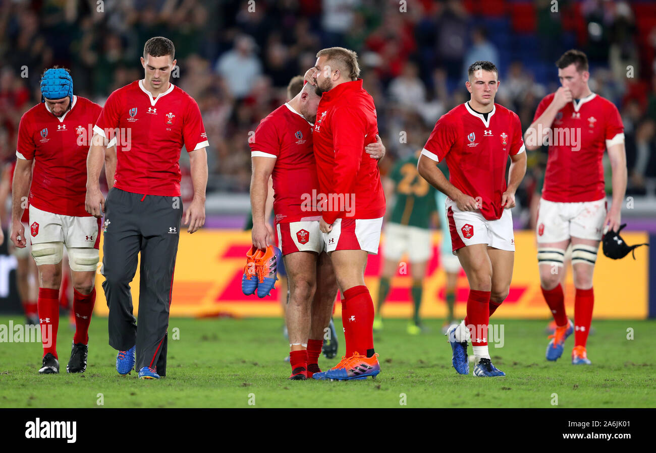 Wales' Tomas Francis (centre right) and Dillon Lewis embrace after the ...
