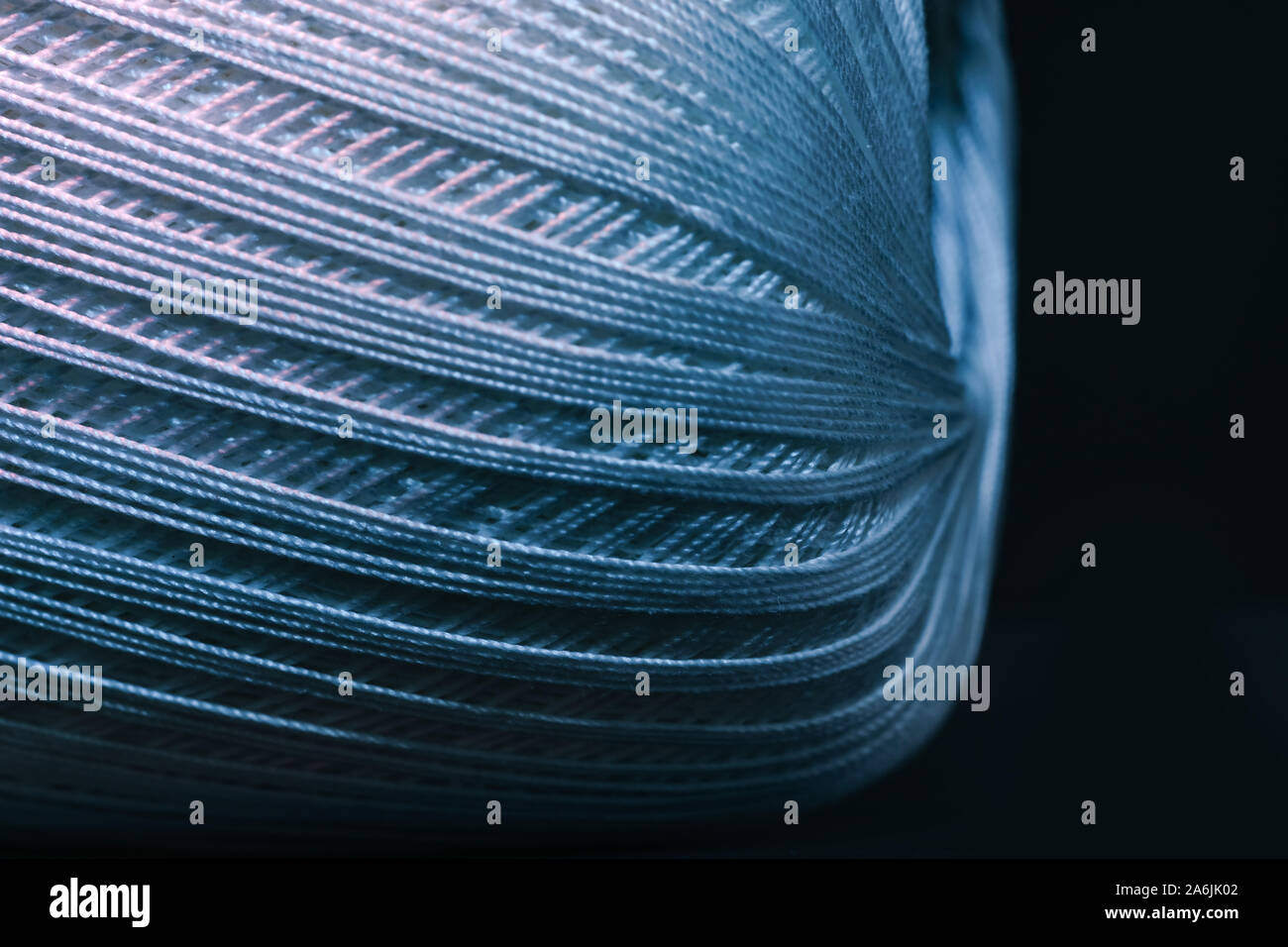 Close up beautiful tangle of thread in red and blue light background ...