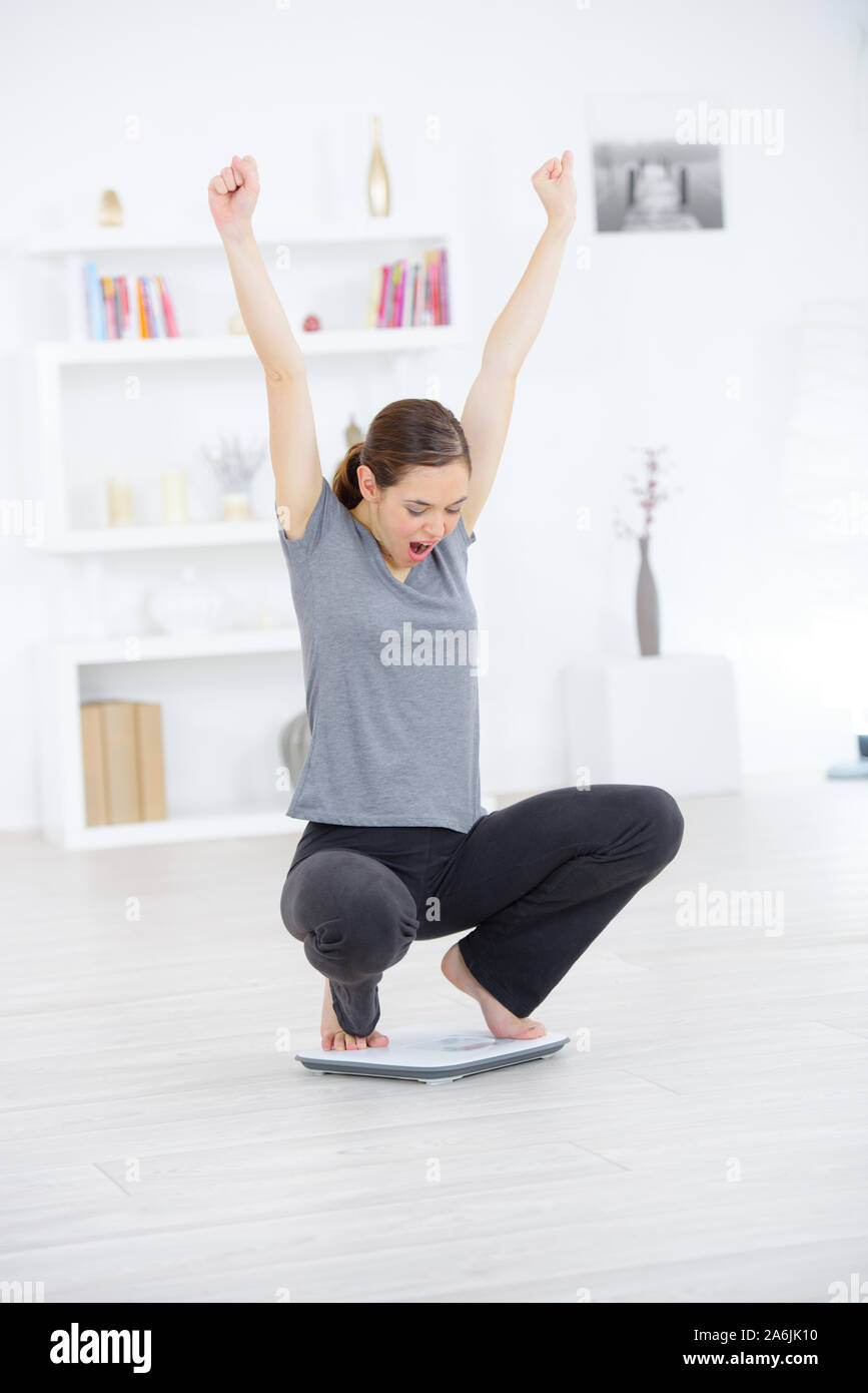 beautiful young woman happy as she lots weight Stock Photo - Alamy