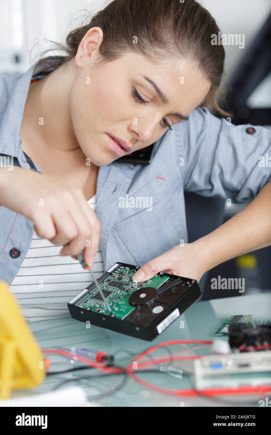 engineer fixing broken computer hard drive Stock Photo - Alamy