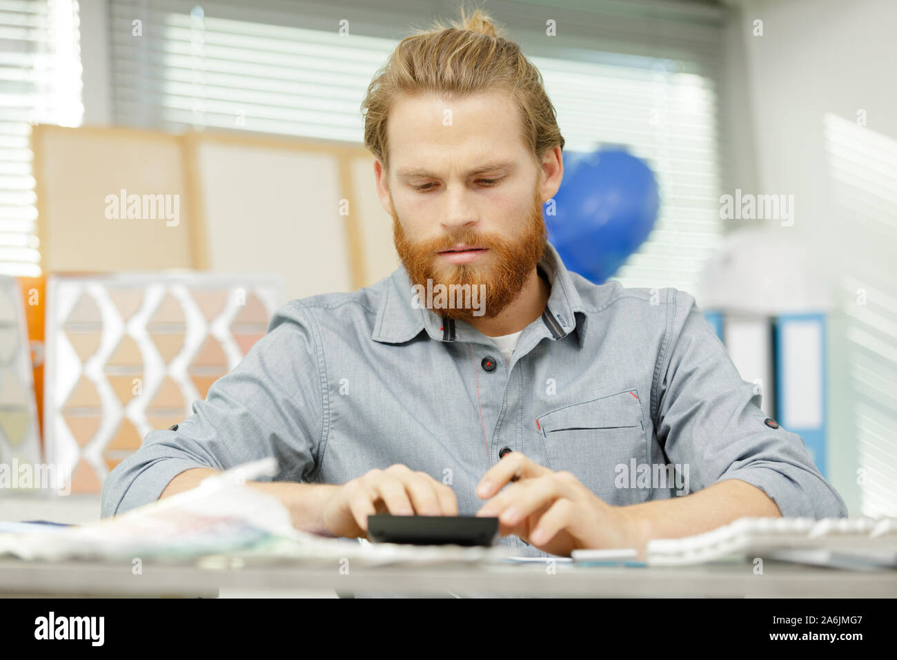 a man analyzing investment charts Stock Photo - Alamy