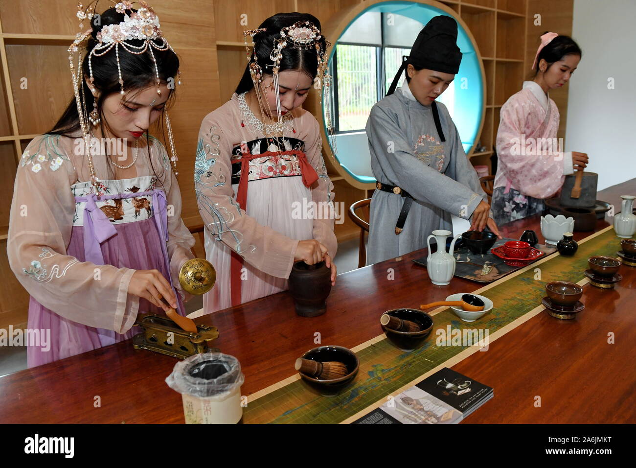 Nanping, China. 27th Oct, 2019. Girls in traditional costumes shows a ...