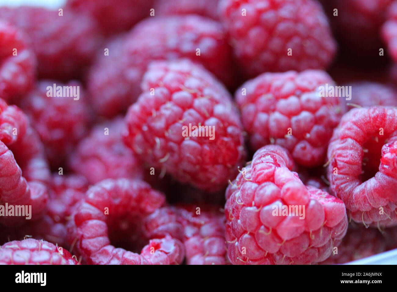 Background with fresh raspberry closeup. Raspberry macro photography ...