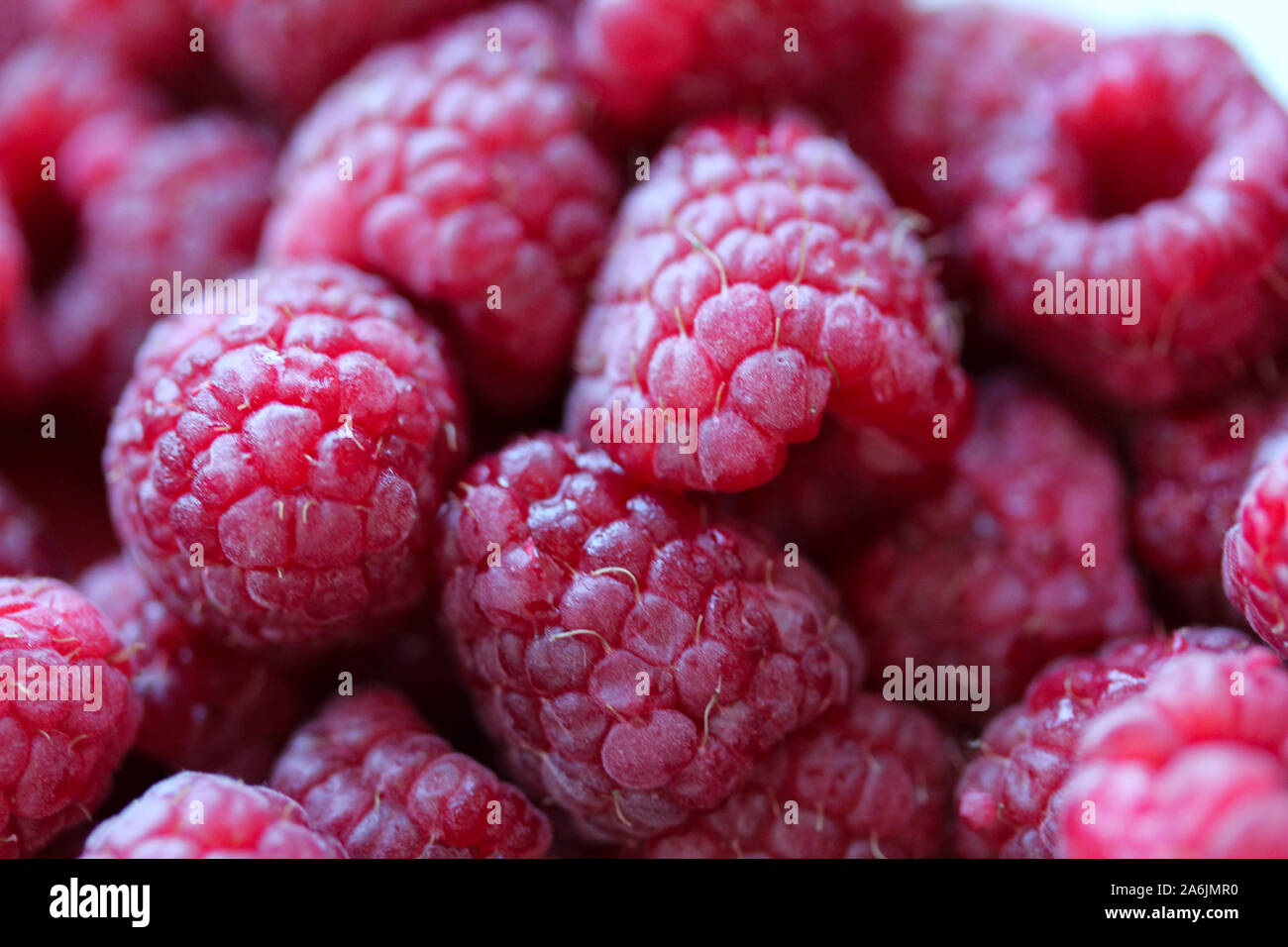 Background with fresh raspberry closeup. Raspberry macro photography ...
