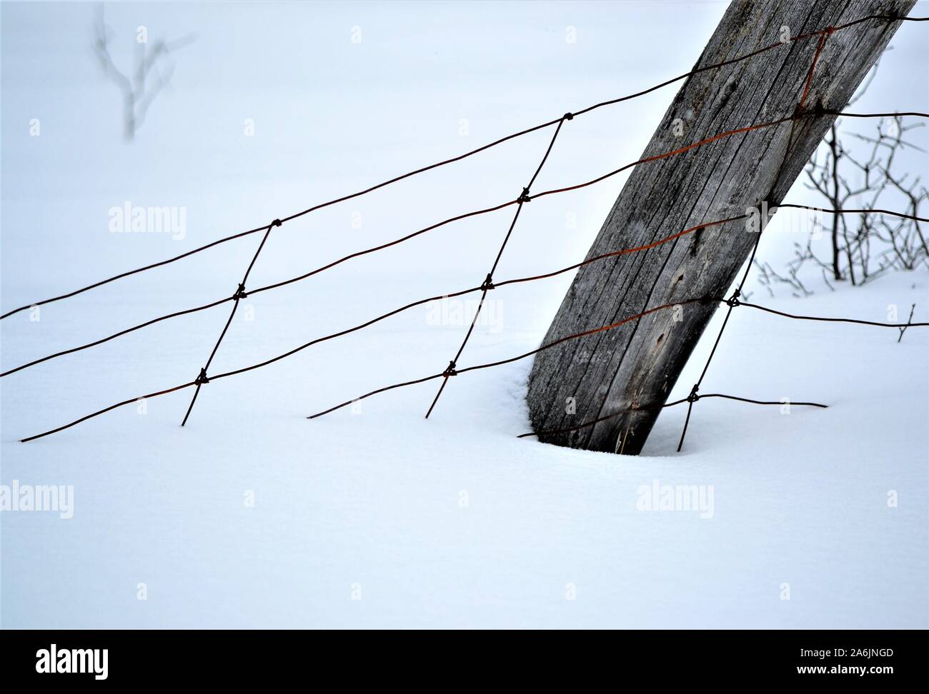 Old fence post with wire fence in deep snow Stock Photo - Alamy