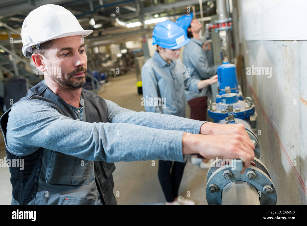 close up of production operators at work Stock Photo - Alamy