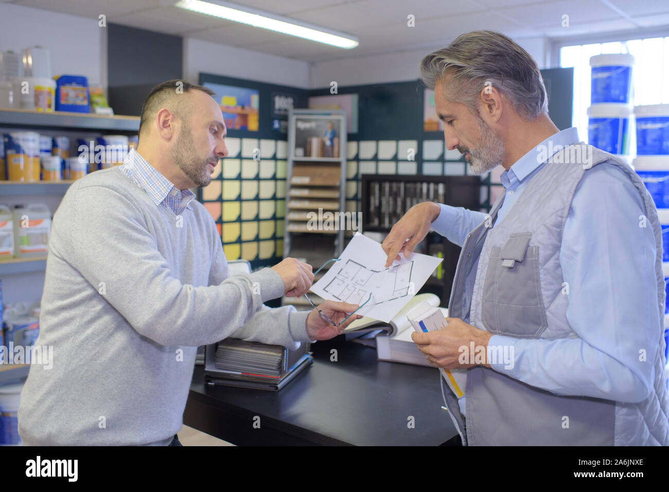 customer talking and choosing color in a household store Stock Photo ...
