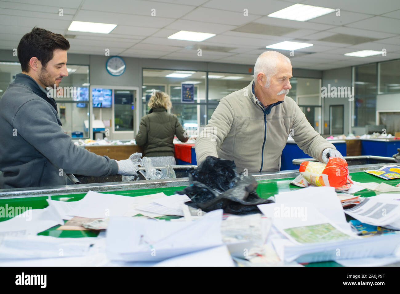 team of workers sorting waste Stock Photo - Alamy