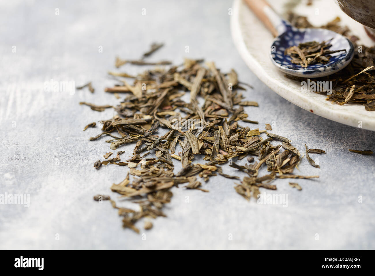 Dried Green Tea Leaves on Bright Background. Close up Stock Photo - Alamy