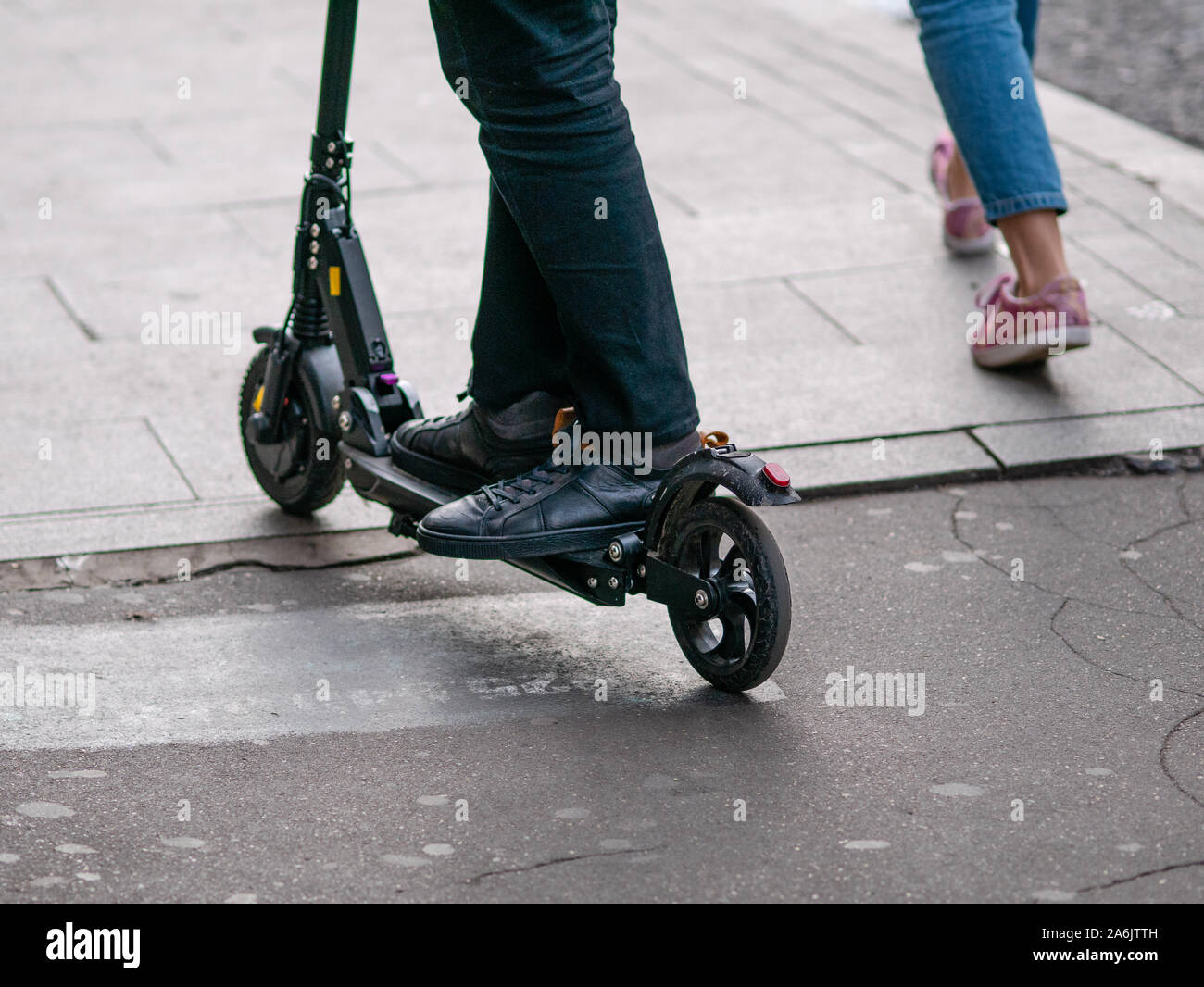 Male rides electric scooter hi-res stock photography and images - Alamy