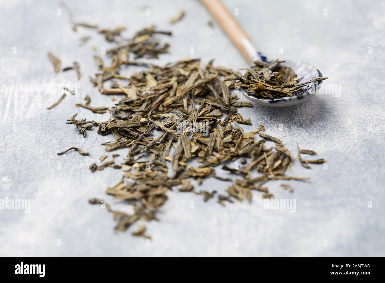 Dried Green Tea Leaves on Bright Background. Close up. Copy space Stock ...