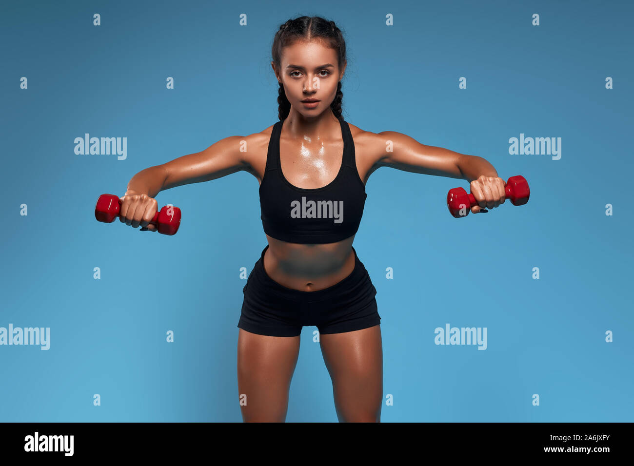 Female bodybuilder with arms raised hi-res stock photography and images ...