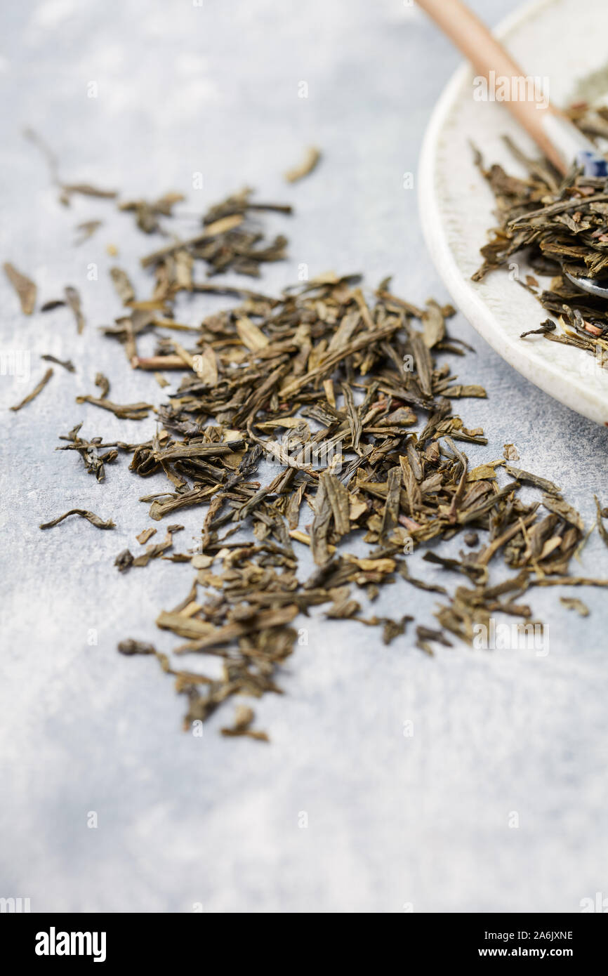 Dried Green Tea Leaves on Bright Background. Close up Stock Photo - Alamy