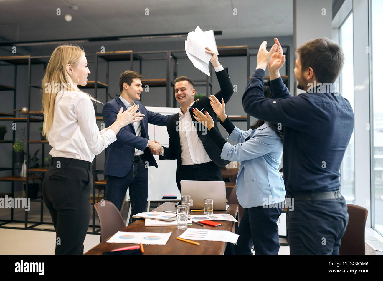 happy business people shaking hands , have signed a successful ...