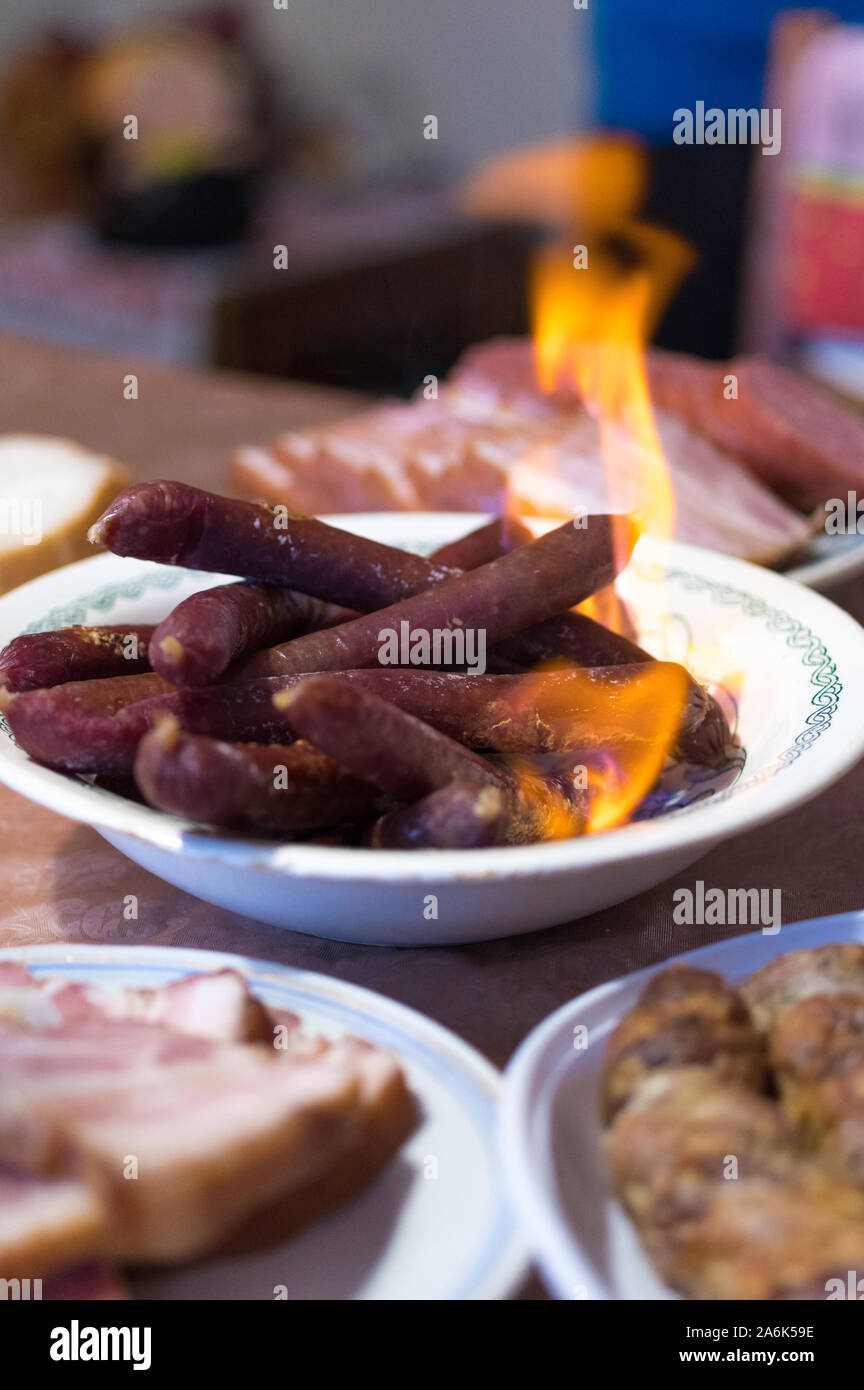 Meat snacks and burning sausages. Sausages and fire Stock Photo - Alamy