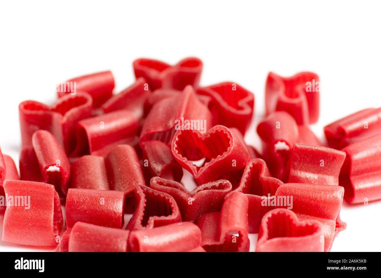 Colorful heart shape macaroni pasta on white background Stock Photo - Alamy