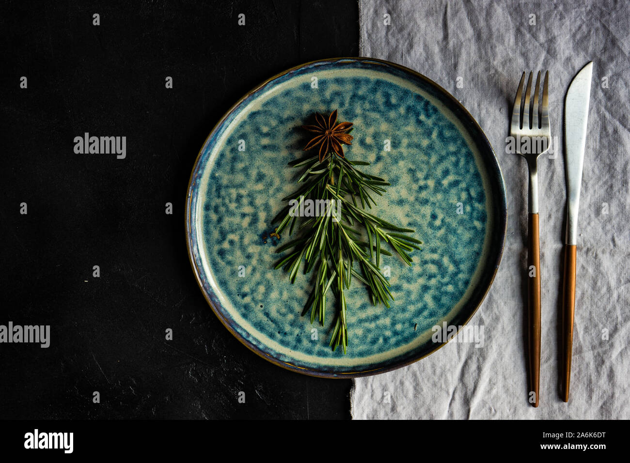 Rustic table setting with cutlery and plates decorated with fresh ...