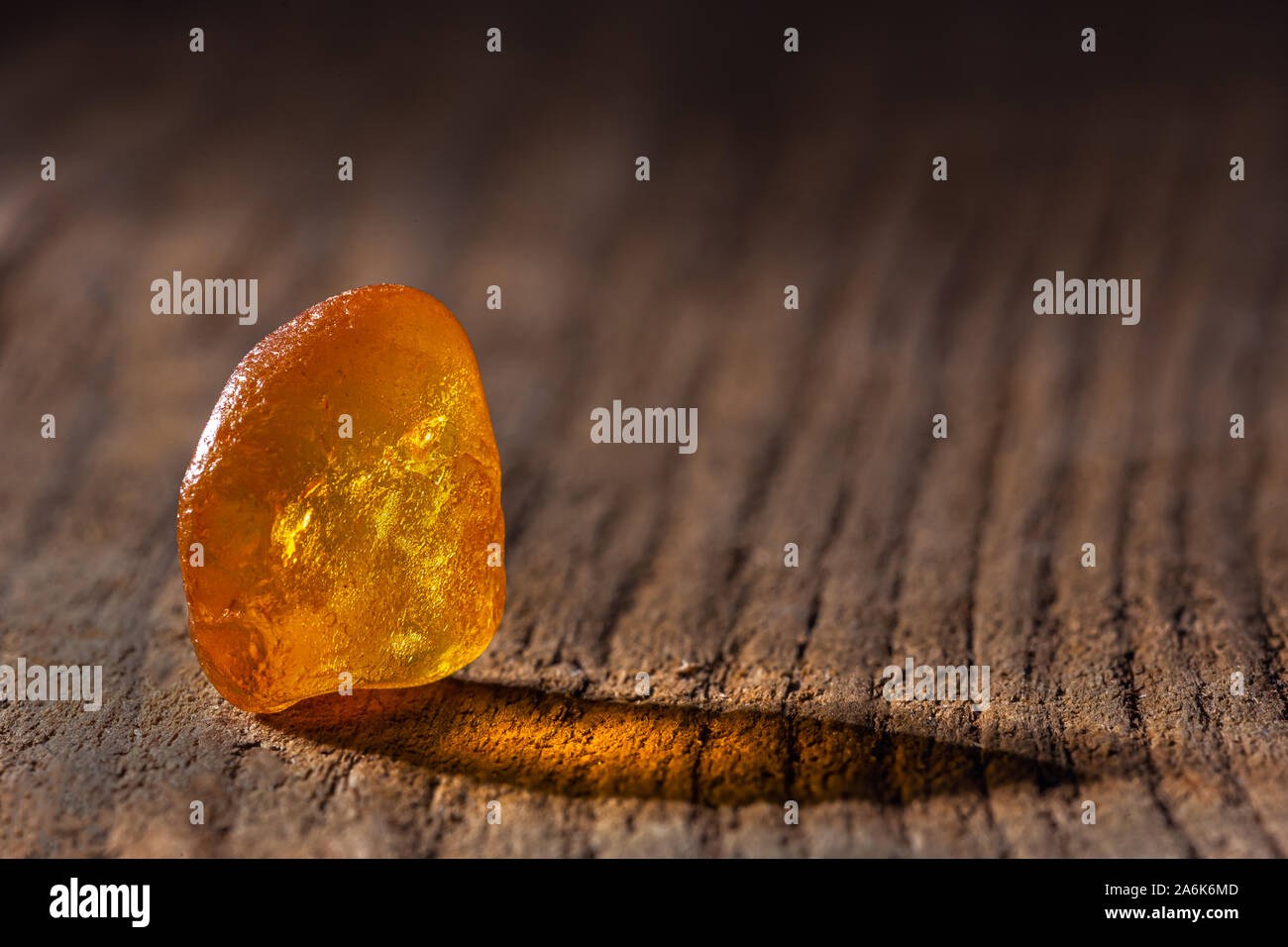 Natural amber. A piece of yellow transparent natural amber on large ...