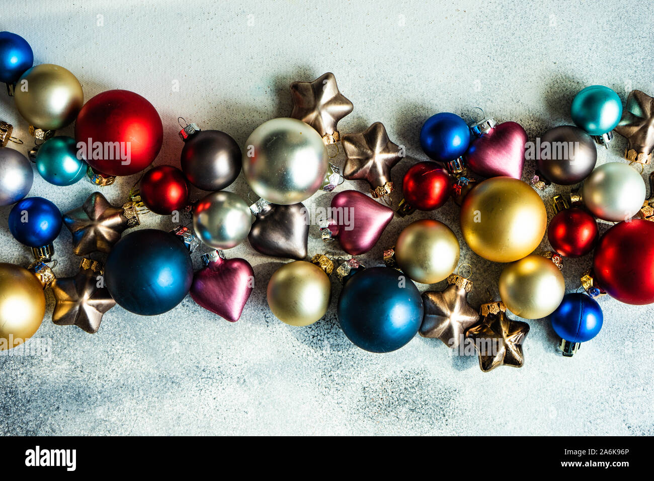 Christmas frame with holiday decor on white and grey stone background ...