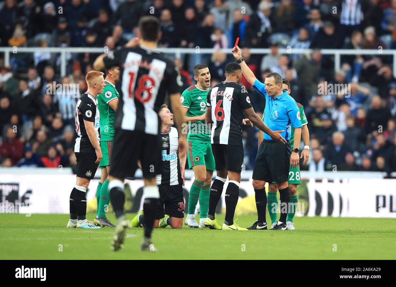 Newcastle United's Sean Longstaff (centre left) is shown a red card by ...