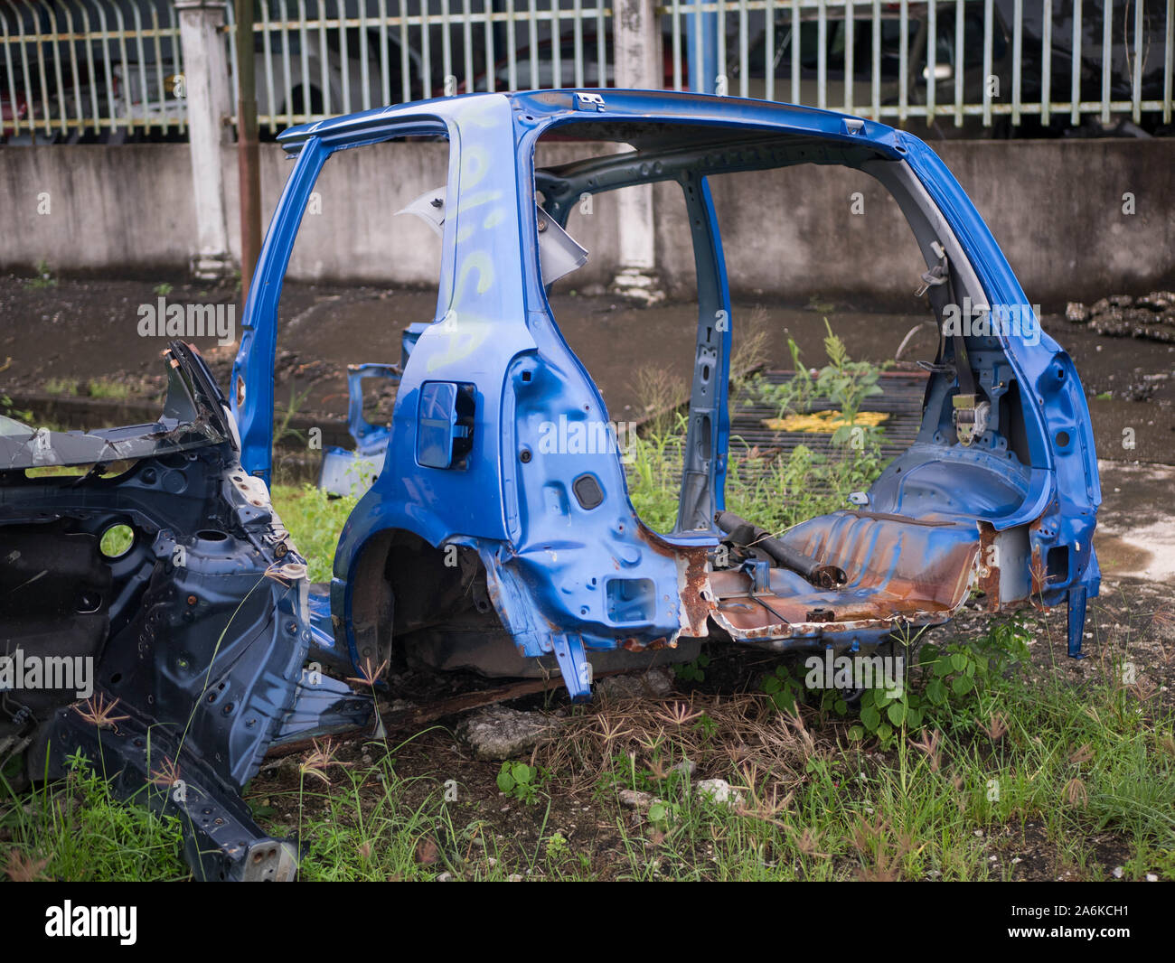 Old rusty half cut car by the road side after the accident at the ...