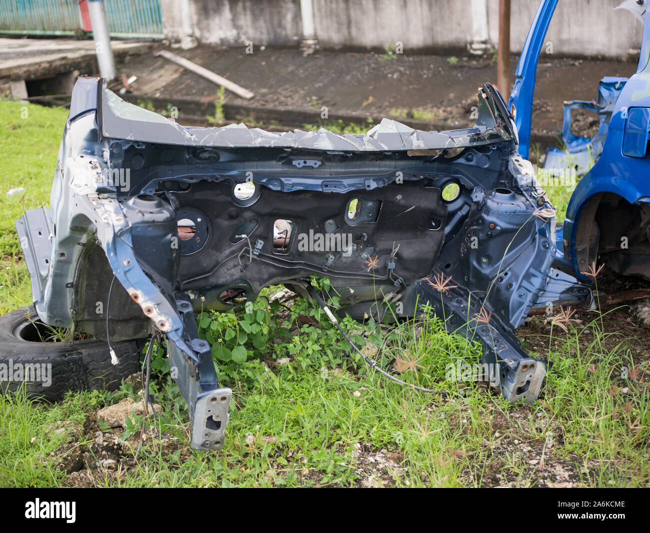 Old rusty half cut car by the road side after the accident at the ...