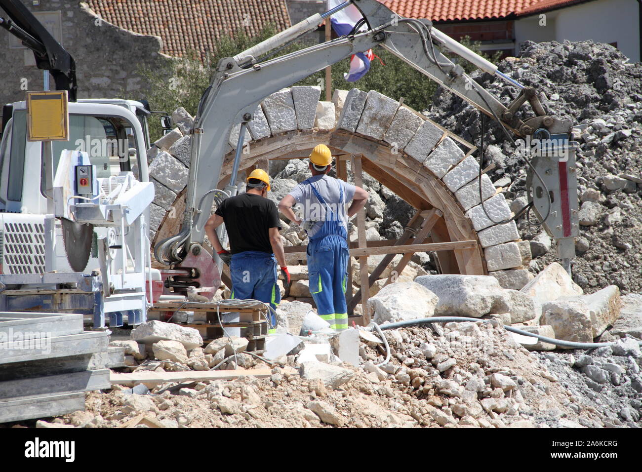 Craftsmen are building a new gate on a construction site Stock Photo ...