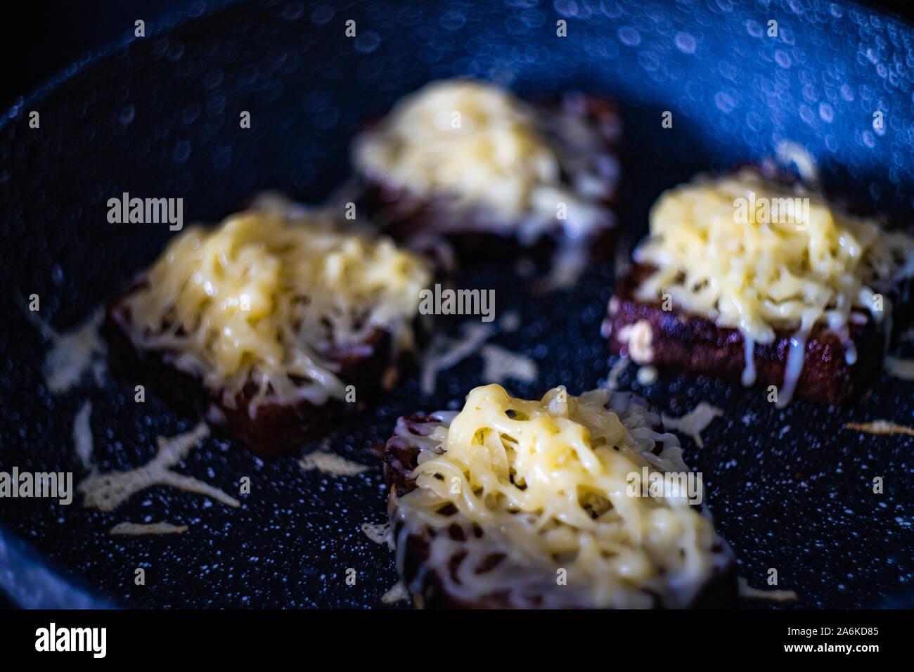 Traditional toasts with cheese on a pan Stock Photo - Alamy