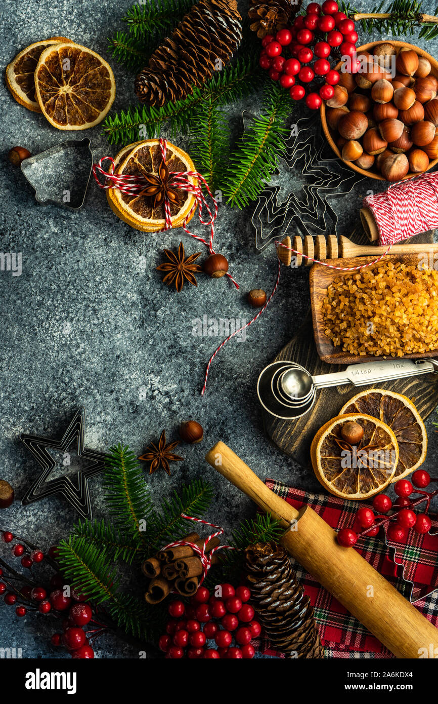 Christmas cooking background with nuts, orange, anise star and cinnamon ...