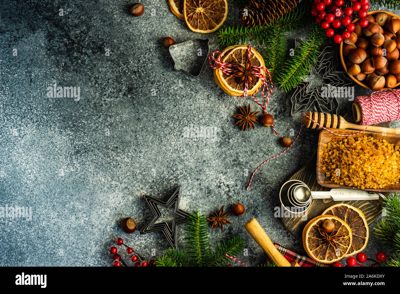 Christmas cooking background with nuts, orange, anise star and cinnamon ...
