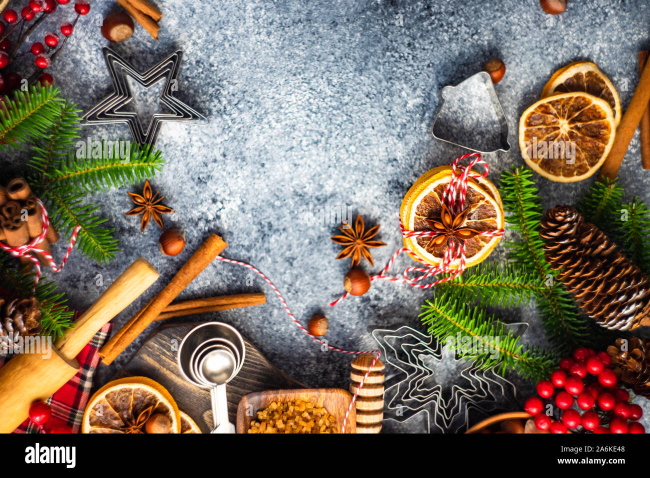 Christmas cooking background with nuts, orange, anise star and cinnamon ...