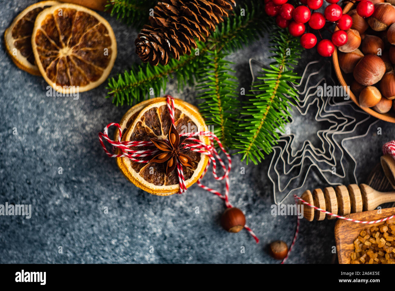 Christmas cooking background with nuts, orange, anise star and cinnamon ...