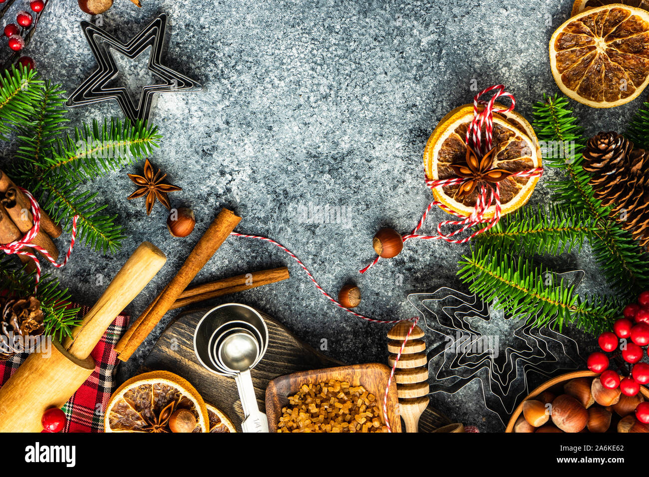 Christmas cooking background with nuts, orange, anise star and cinnamon ...