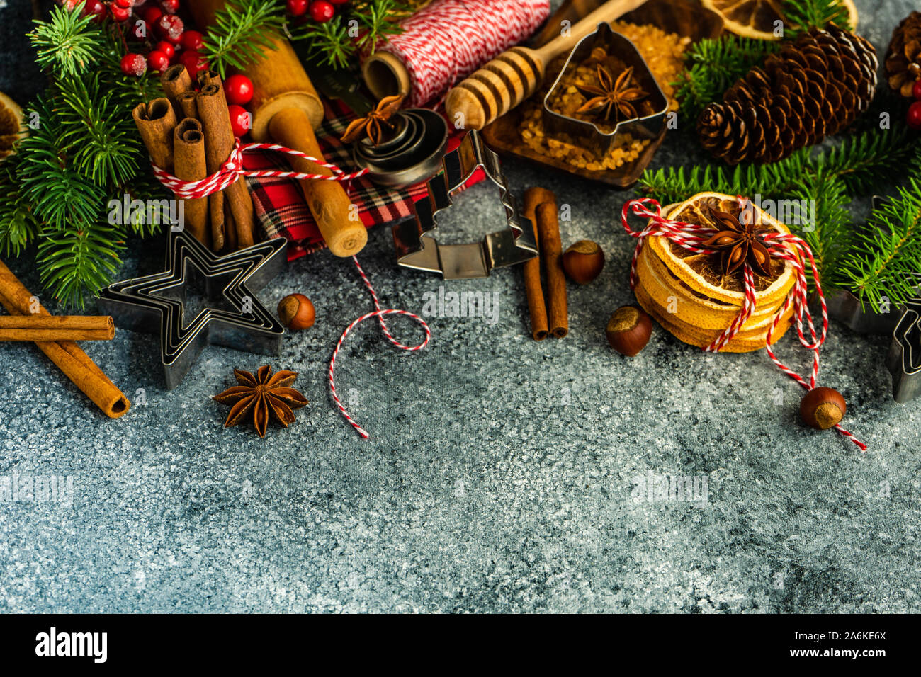 Christmas cooking background with nuts, orange, anise star and cinnamon ...