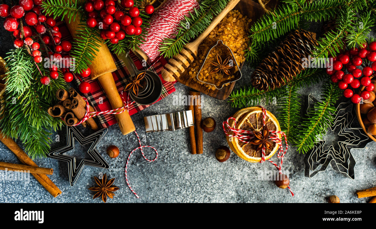 Christmas cooking background with nuts, orange, anise star and cinnamon ...