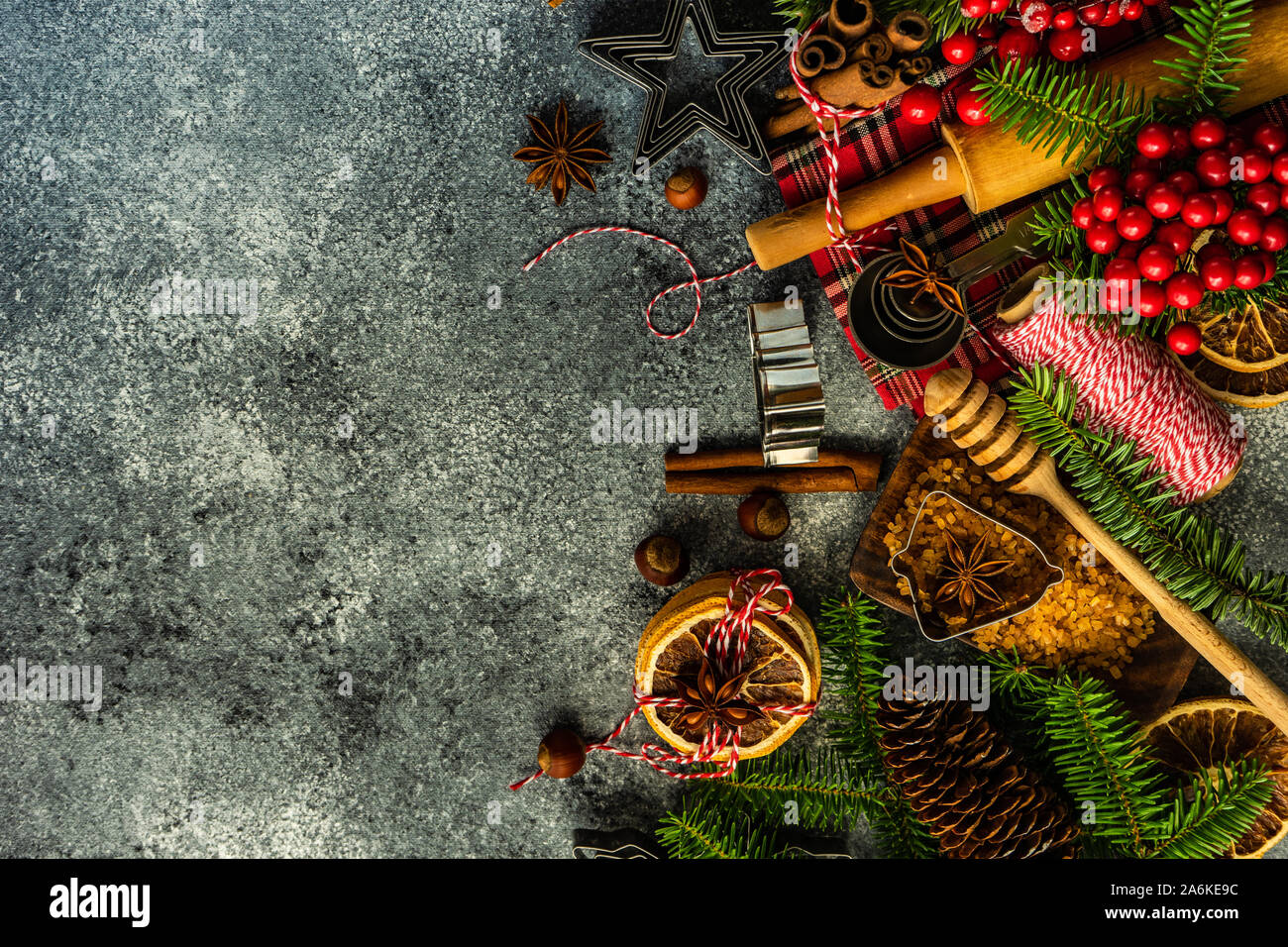 Christmas cooking background with nuts, orange, anise star and cinnamon ...