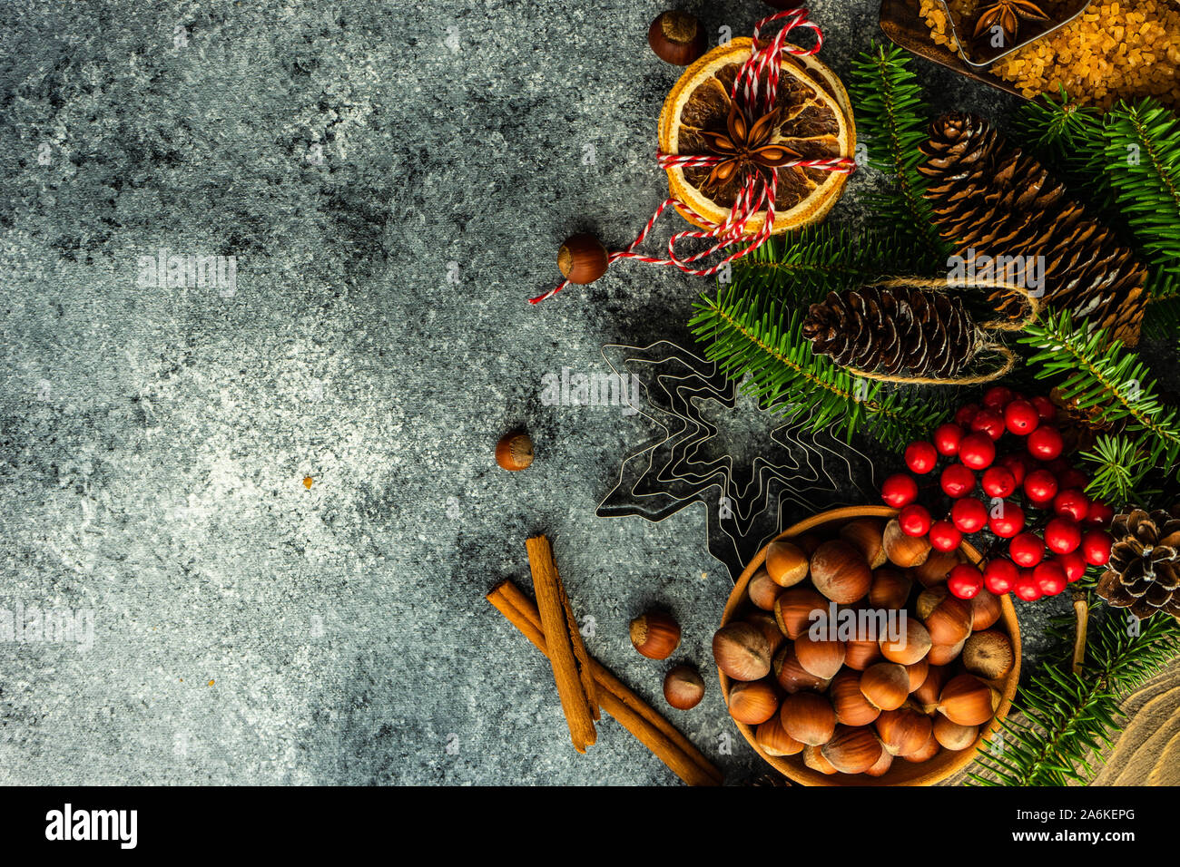 Christmas cooking background with nuts, orange, anise star and cinnamon ...