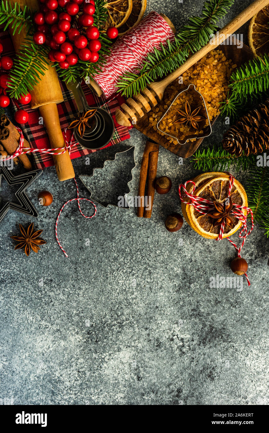 Christmas cooking background with nuts, orange, anise star and cinnamon ...