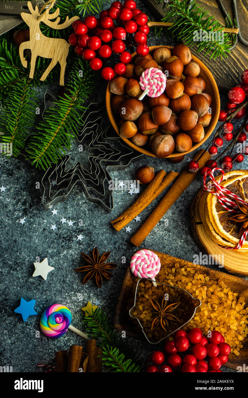 Christmas cooking background with nuts, orange, anise star and cinnamon ...