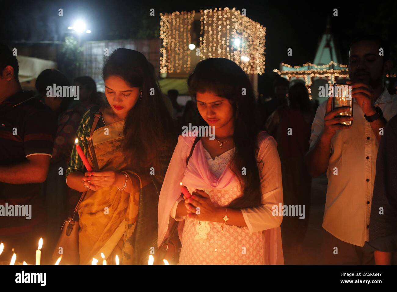 Dhaka, Bangladesh. 27th Oct, 2019. Hindu devotees light up candles ...