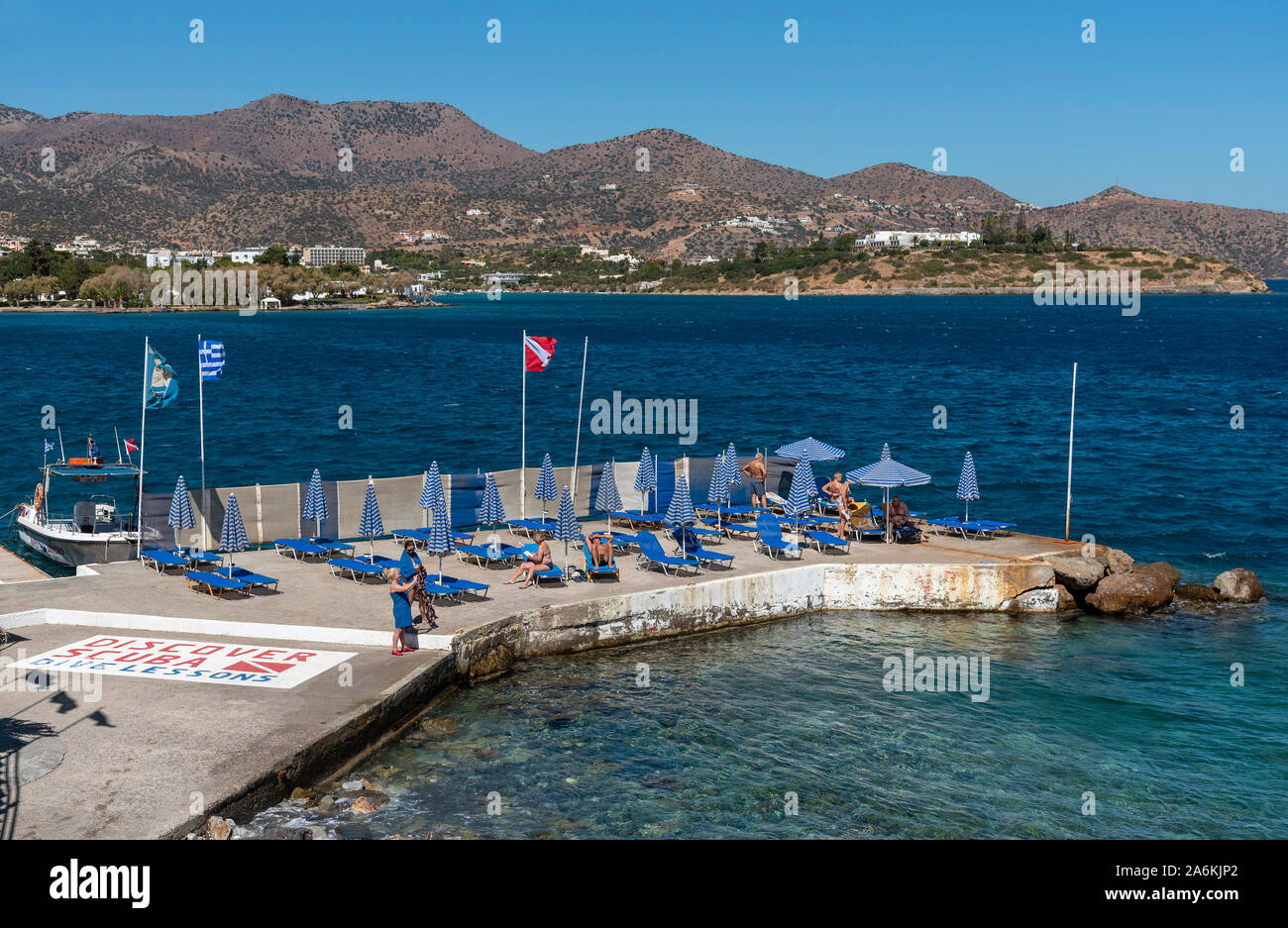 Agios Nikolaus, northern Crete, Greece. October 2019. A sunbathing pier ...