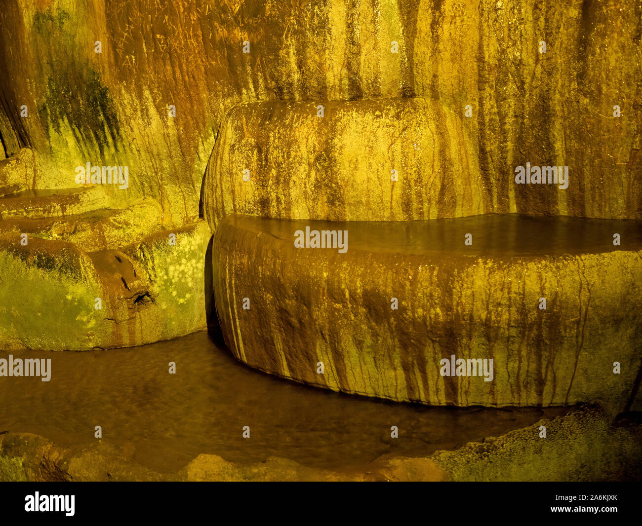 Flowstone rock formation inside a cave.It formed where water flows down ...