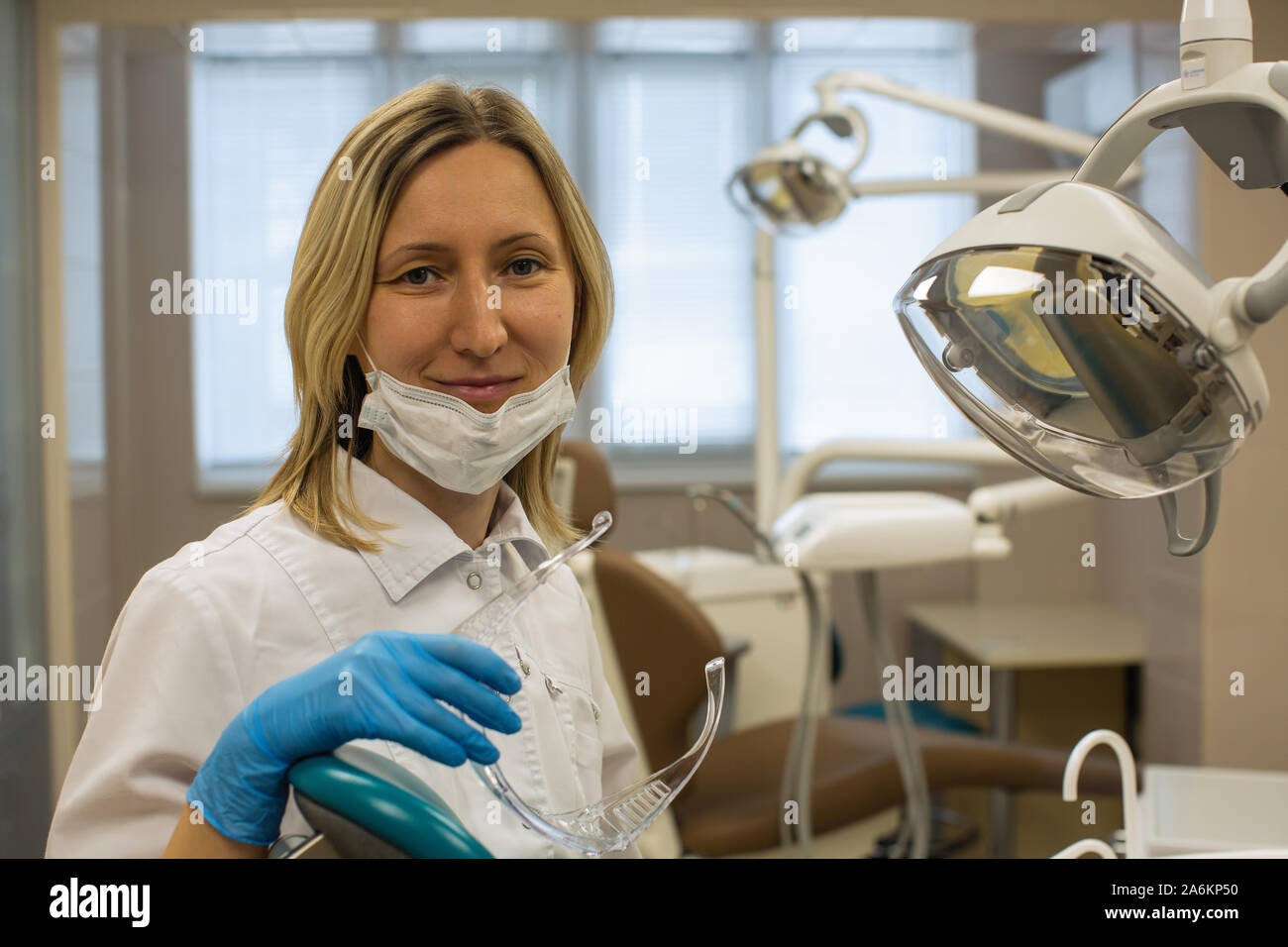 Female dentist portrait, medical office background Stock Photo - Alamy